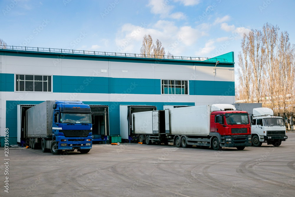 Trucks loading in warehouse for cargo transportation Stock Photo ...