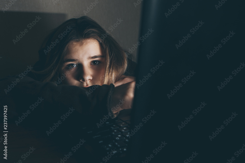 Teenager girl suffering internet cyber bullying scared and depressed ...
