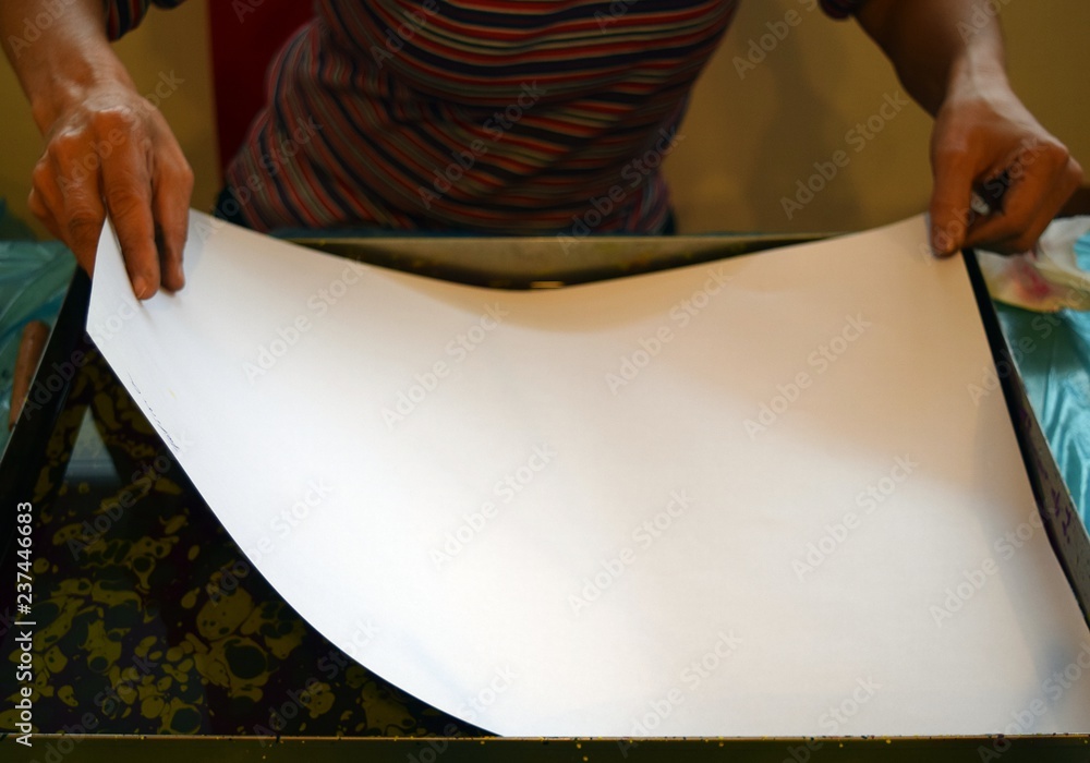 Artist Ebru, the art of painting on water transfers drawing to paper ...