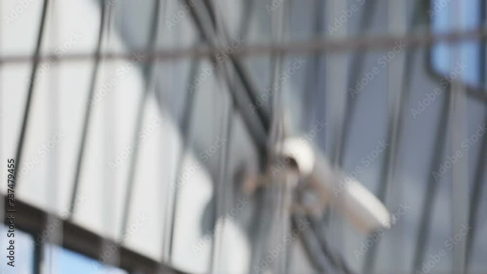 White surveillance cameras, safety monitoring, colorful garland. Video ...