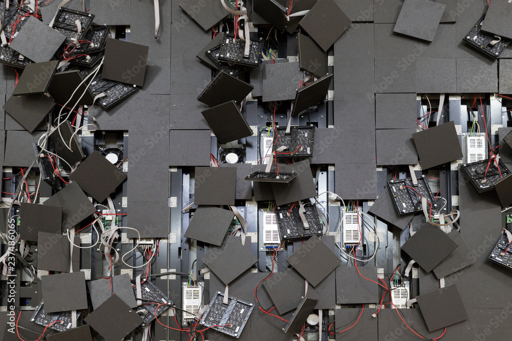 Mounting or repair of LED modulars wall. Close-up view of LED panels ...
