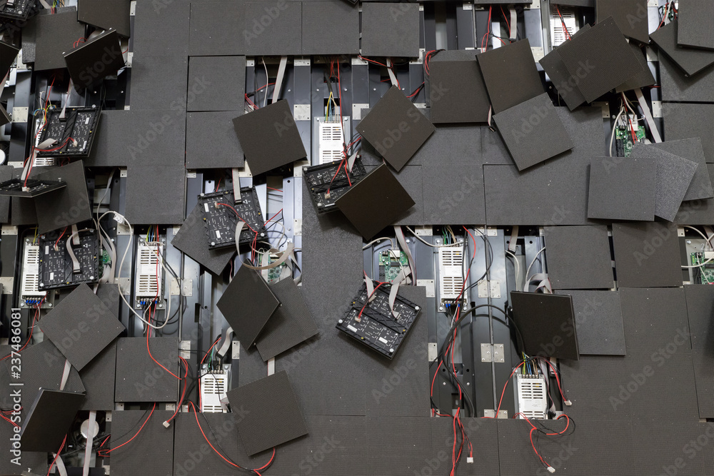 Mounting or repair of LED modulars wall. Close-up view of LED panels ...