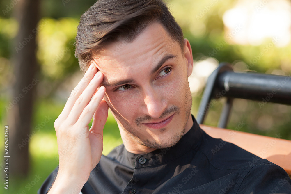 portrait of a serious young man. a young brunet male wondered, emotion ...