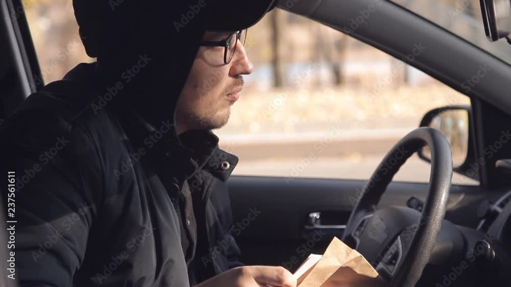 A private detective or a spy conducts surveillance of the object of ...