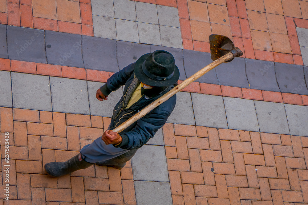 Above view of unidentified indigenous man walking in the sidewalk and ...