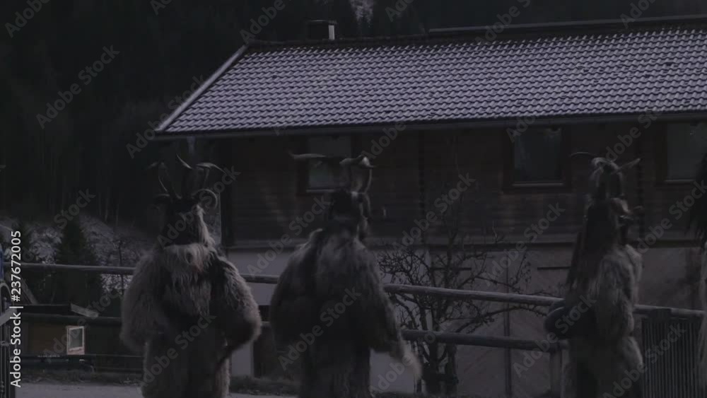 A Traditional Krampus group runs away in Gastein Austria Folklore ...