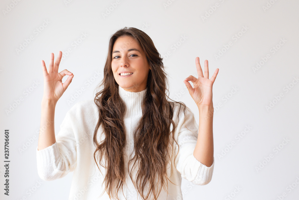 Attractive happy young woman showing ok signs. Beautiful girl with long ...