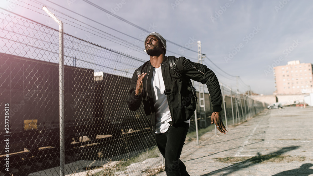 Young man running and missing the train Stock Photo | Adobe Stock