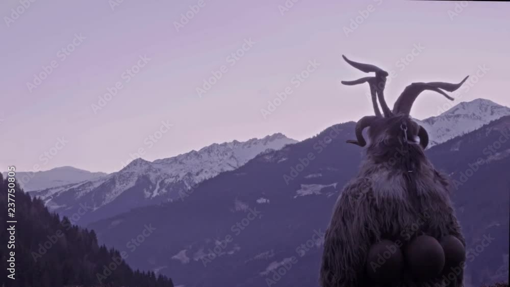 Vidéo Stock A Traditional Krampus in Gastein Austria looks over the ...