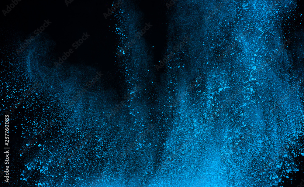 abstract blue powder splatted background,Freeze motion of color powder ...