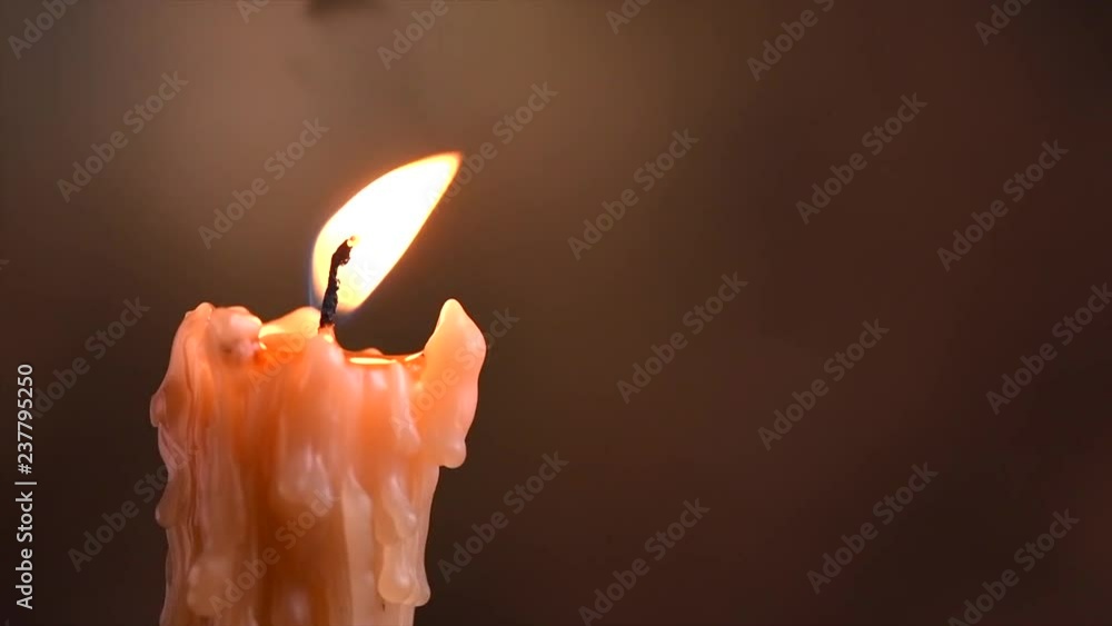 Candle flame closeup on dark background. Candle light border design ...