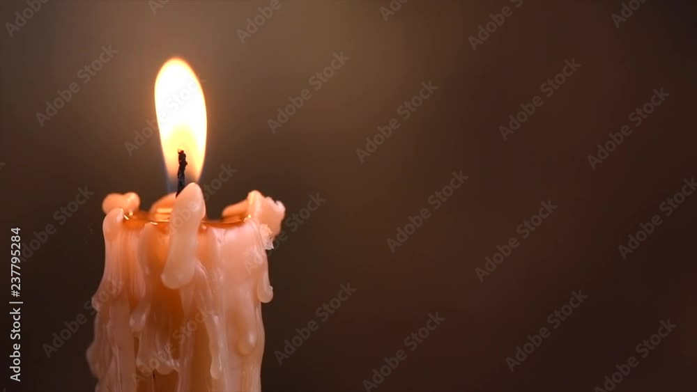 Candle flame closeup on dark background. Candle light border design ...