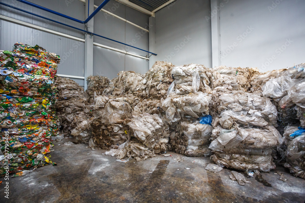 Plastic pressed bales at finished products warehouse on modern waste ...