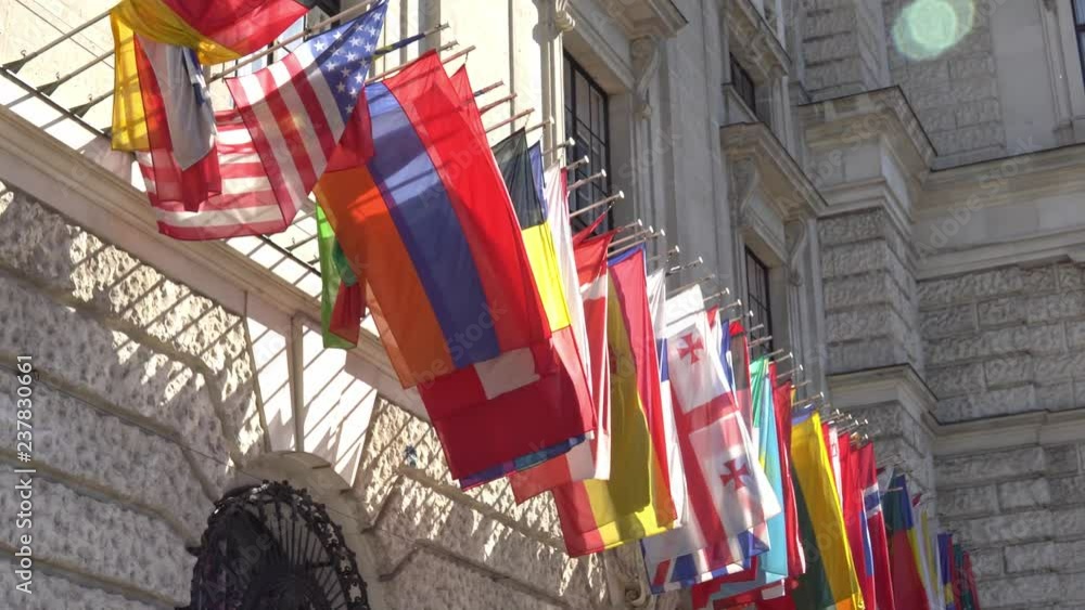Flags of the OSCE participating States on the headquarters building in ...