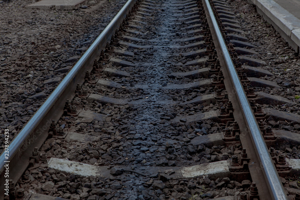 Railroad in motion at sunset. Railway station with motion blur effect ...