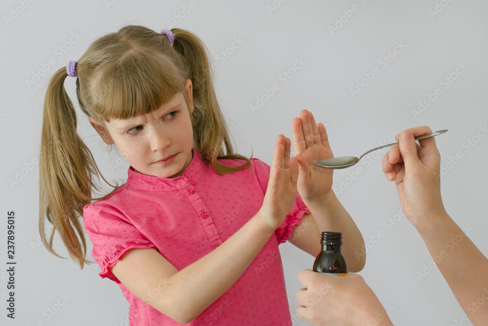 kid child refuses to take medication Stock Photo | Adobe Stock
