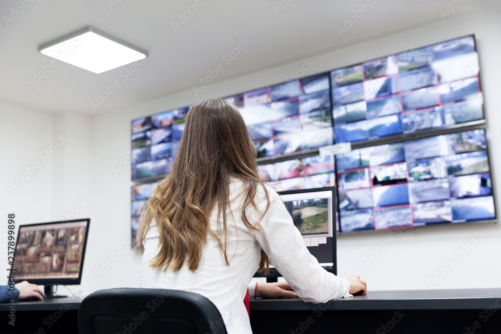 Security control room operator at work Stock Photo | Adobe Stock