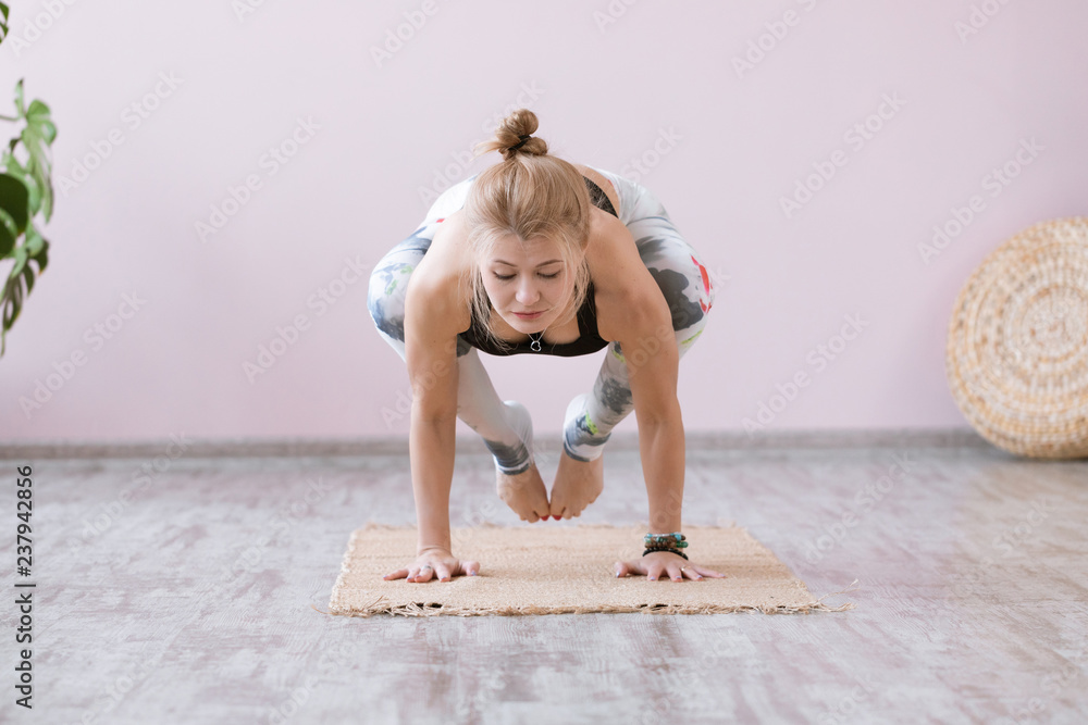 Yoga woman training on exercise mat and doing balance yoga poses on ...