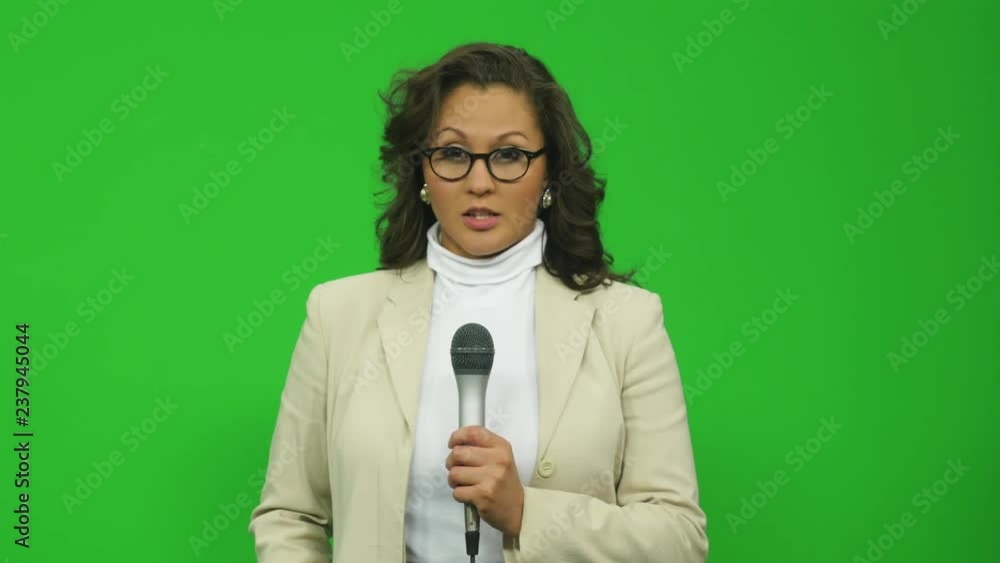 Serious Female News Reporter In Front of a Green Screen Stock ビデオ ...