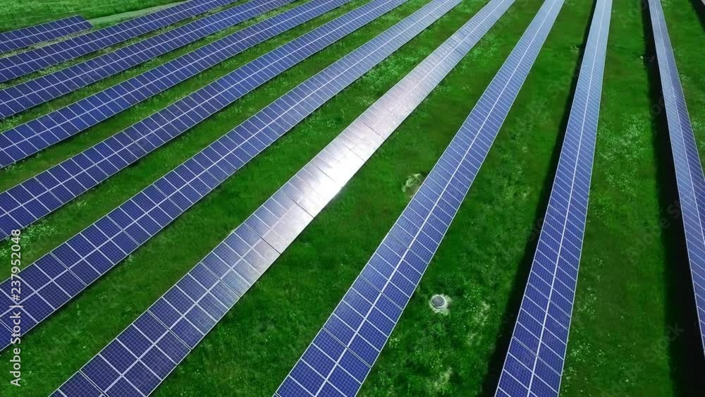 Photovoltaics modules in solar farm station. Aerial view of solar cells ...