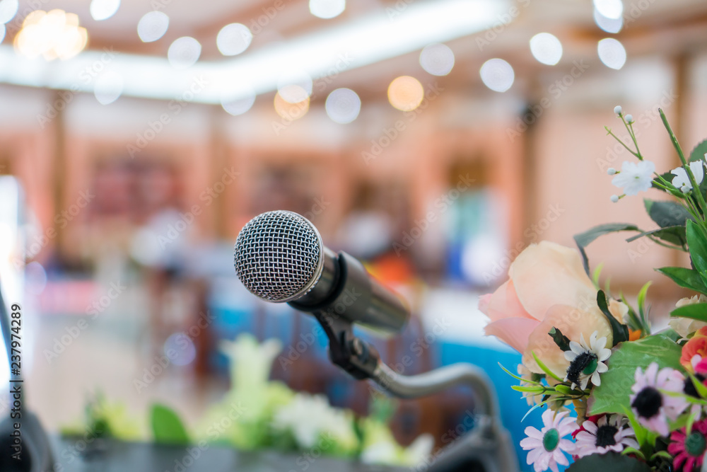 Microphone on abstract blurred of speech in seminar room or speaking ...