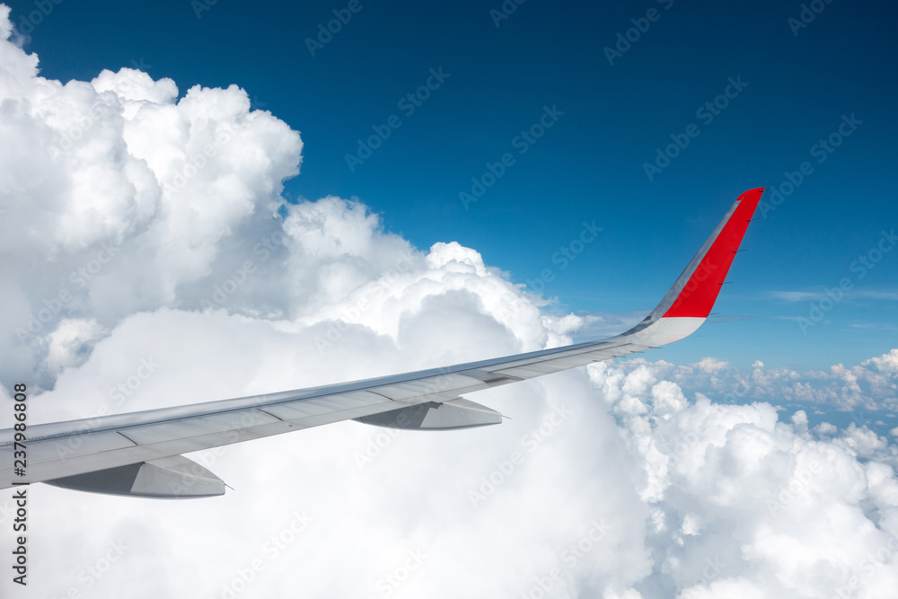 Airline low-cost flight wing in the morning with beautiful white cloudy ...