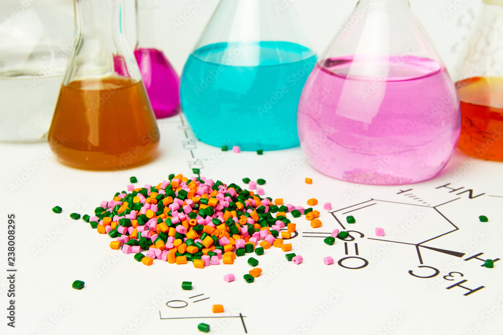 Plastic raw material in granules against the background of Chemical ...