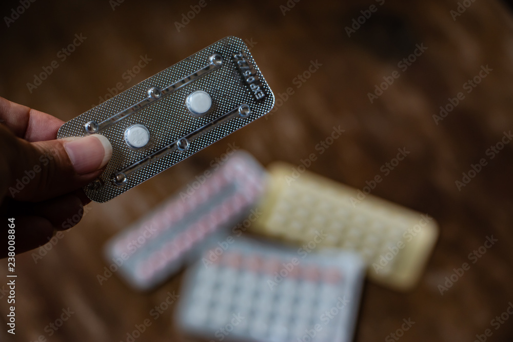 Hand holding an Emergency contraceptive pills on other Birth control ...