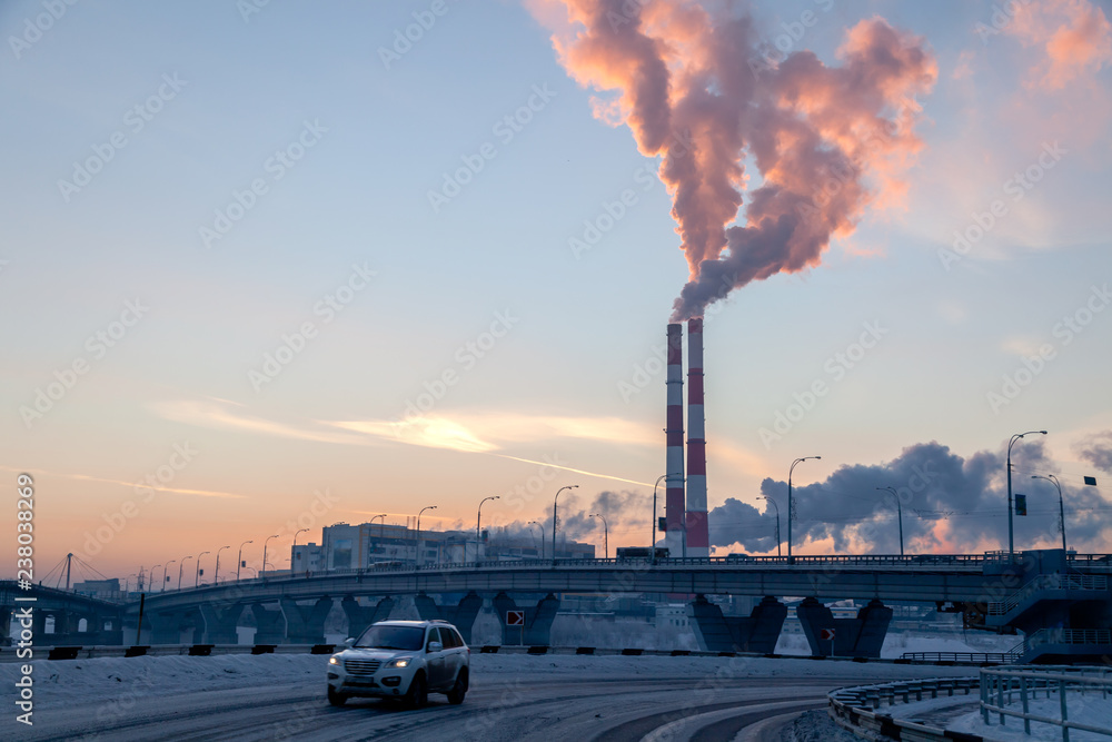 Cityscape car rides on background of bridge, smoke of factory pipes ...