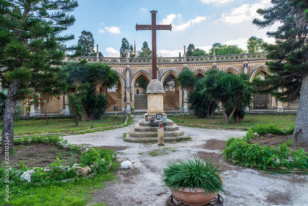 A cross in front of the Arcade for Tablets, a portico at the Santa ...