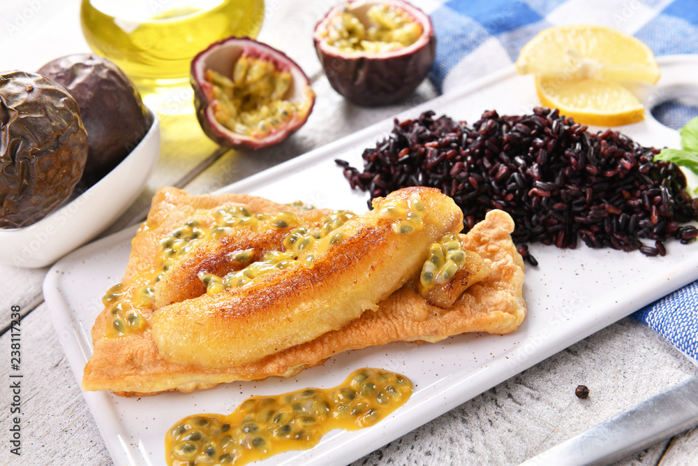 Traditional madeira dish - scabbardfish with bananas and passion fruit ...