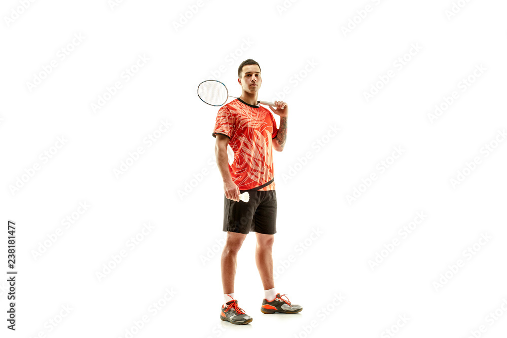 Young man badminton player standing over white studio background. Fit ...