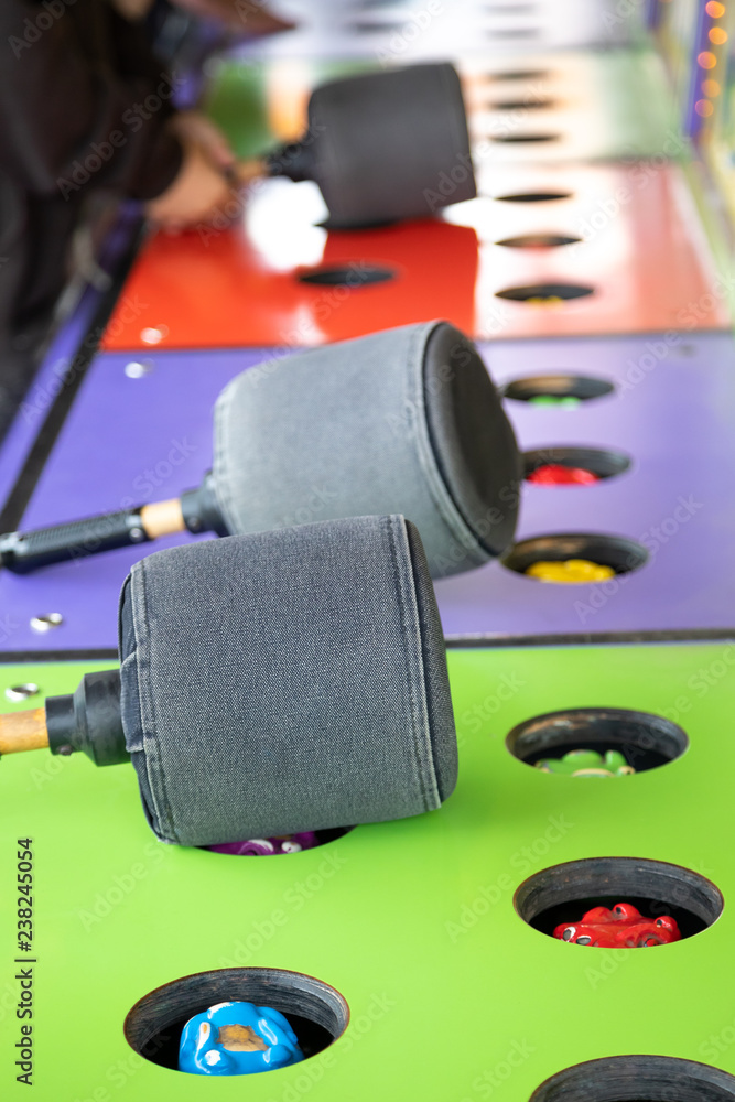 Padded mallet on a carnival whacking game Stock Photo | Adobe Stock