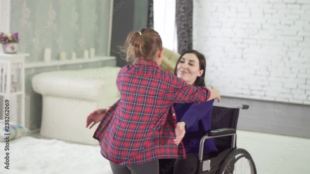 young disabled woman, wheelchair and child, hugs and care Stock ビデオ ...
