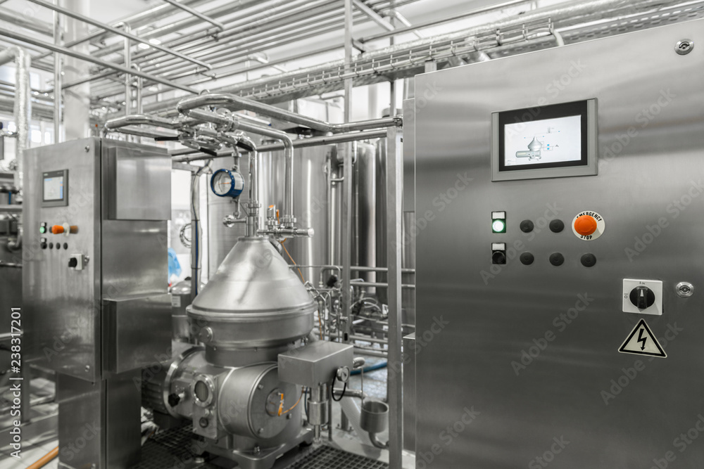 electronic control panel and tank at a milk factory. equipment at the ...