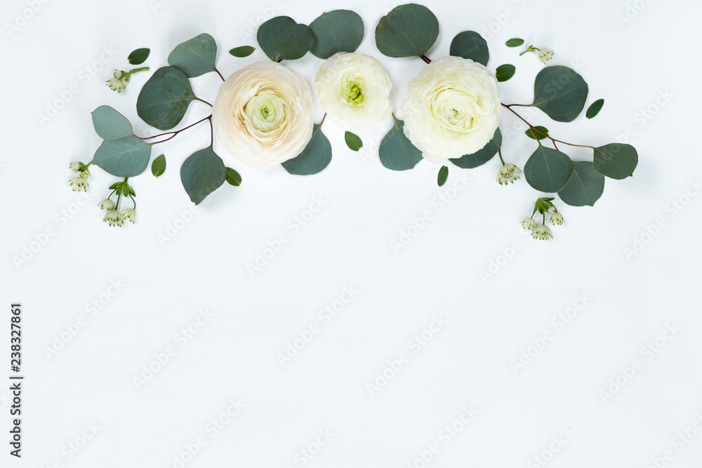 Flower spring frame with fresh branches of ranunculus and pion roses ...