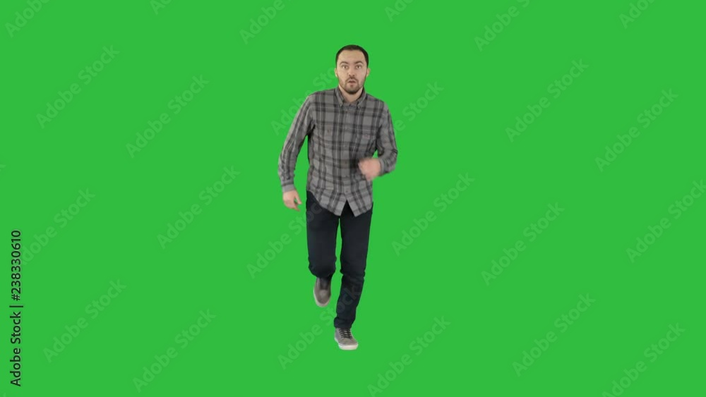 Man starting to run in casual clothes on a Green Screen, Chroma Key ...