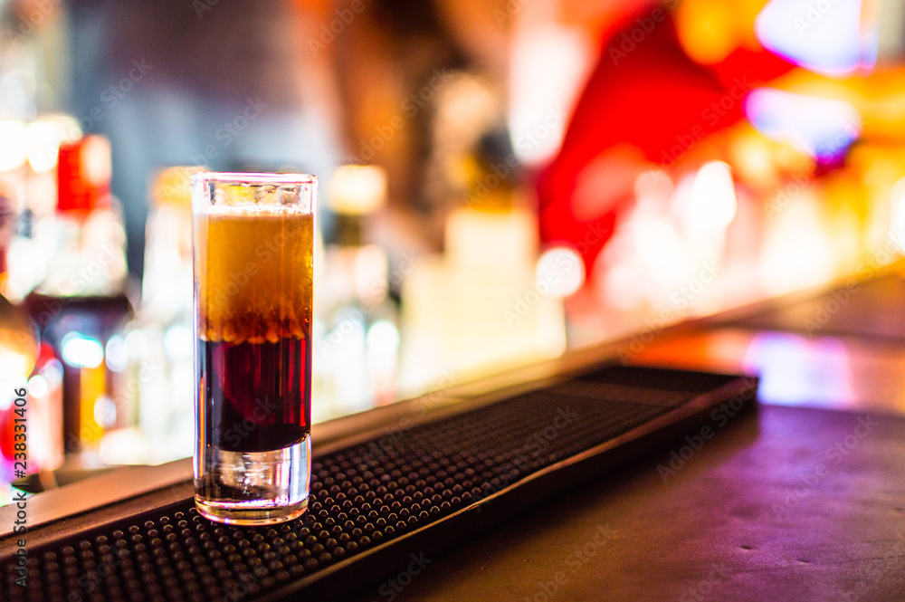 colored and beautiful Chupito drink with bokeh blurred background of an ...