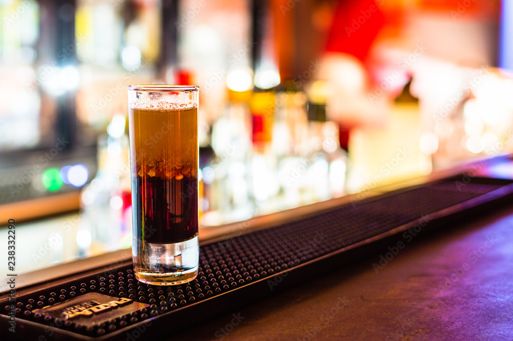 colored and beautiful Chupito drink with bokeh blurred background of an ...
