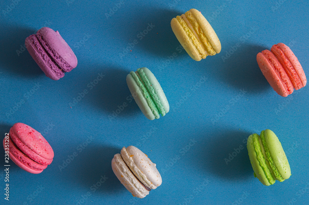 Flat lay. Close up. Sweet bright french macarons color laid out on the ...