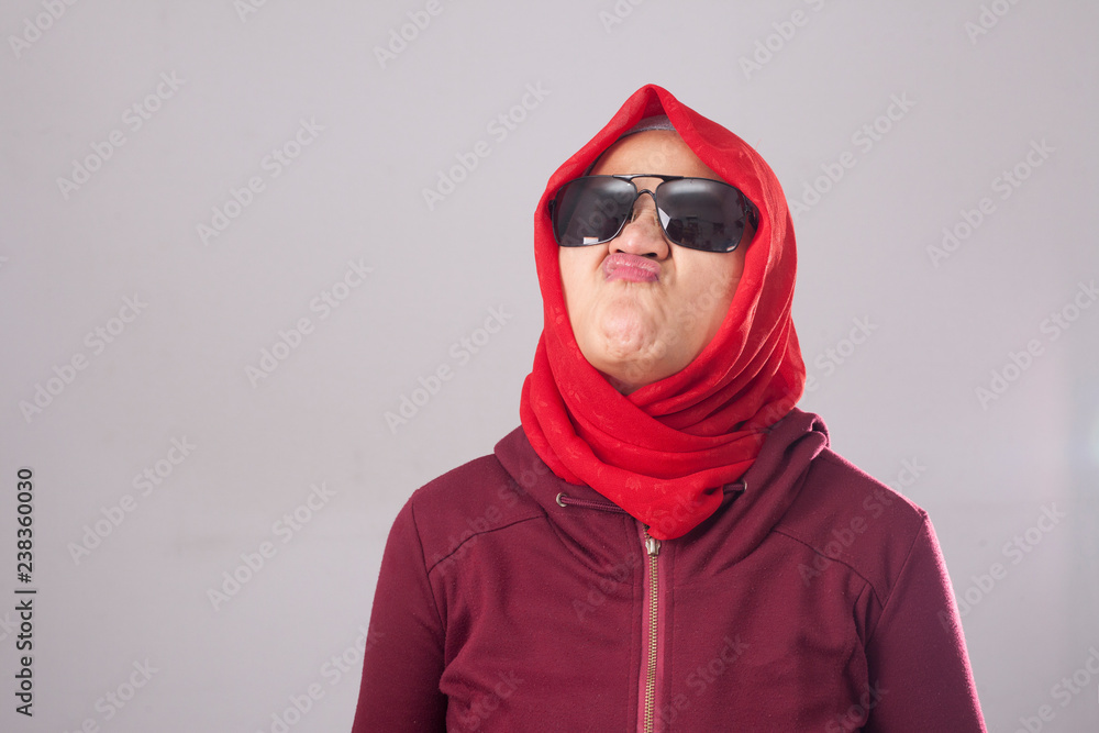 Muslim Lady Smelling Something Bad Stock Photo | Adobe Stock