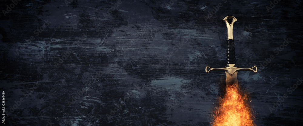low key banner of silver sword in the flames of fire. fantasy medieval ...