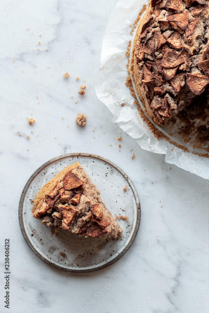 Apple cake and served piece on carrara marble Stock Photo | Adobe Stock