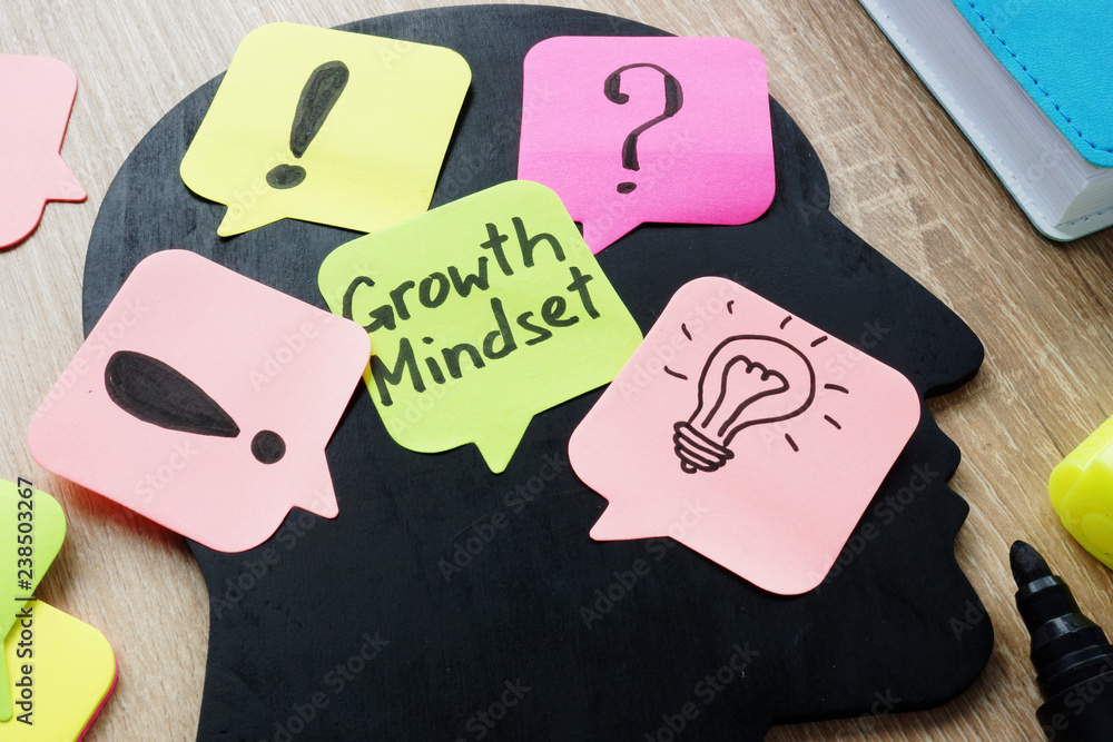 Growth Mindset written on a memo stick. Stock Photo | Adobe Stock