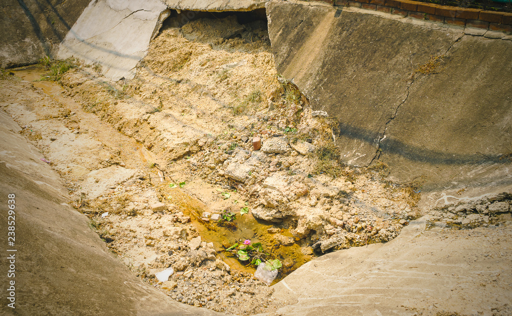 Soil subsidence on Drainage Canal, Erosion of the eroded soil, Layer of ...