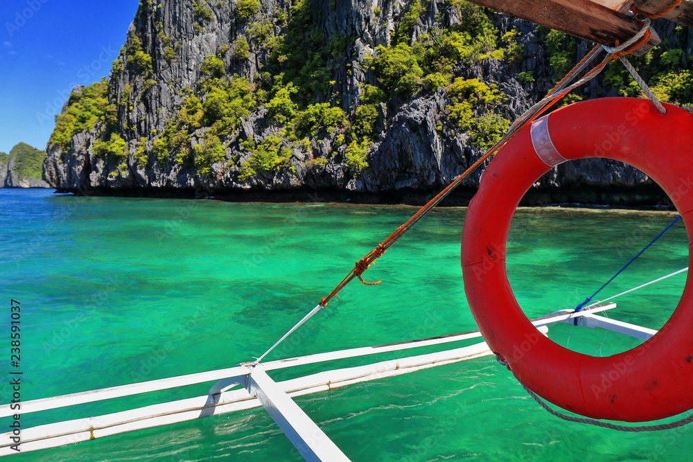 Sailing Bacuit bay: Popolcan island cliffs and rocks. El Nido-Palawan ...