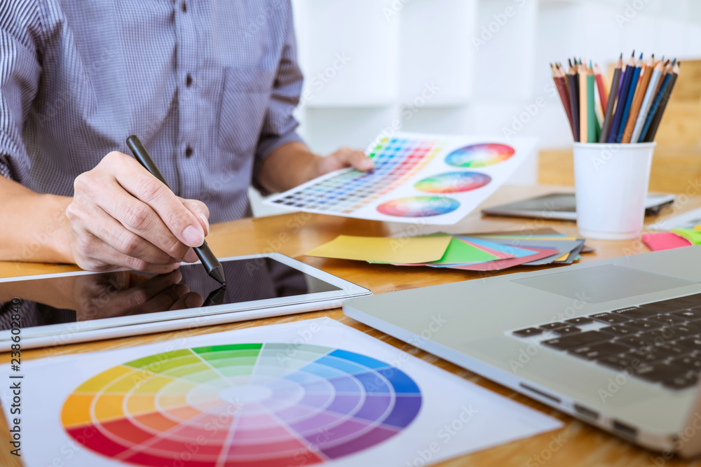 Young creative graphic designer working on project architectural ...