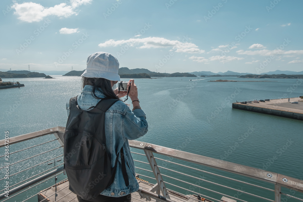 Woman take photo on the top of Misumi Port Umi no Pyramid, Pyramid of ...