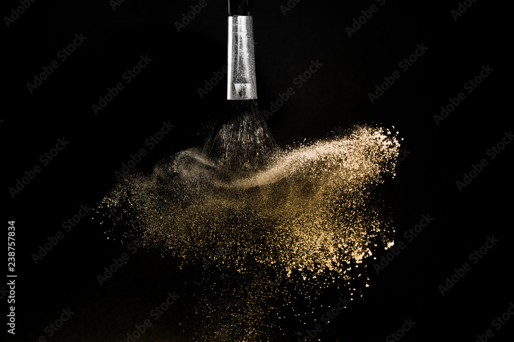 gold powder splash and brush for makeup artist or graphic design in ...