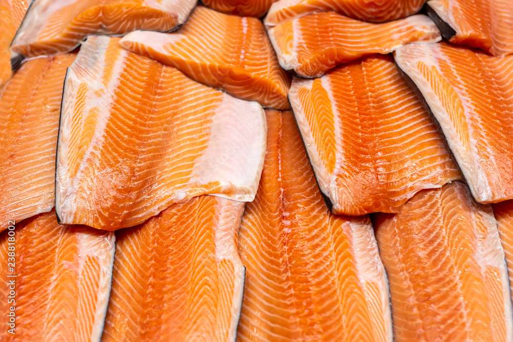 Fresh seafood on crushed ice at fish market. Raw salmon fillet on ...